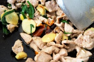 Pork stir-fry recipe with ginger and spring onions